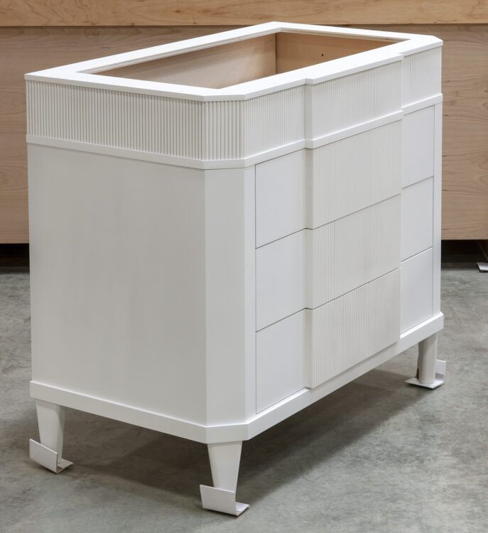 Reeded Vanity with Pipe Chase Drawers - Crown Point Cabinetry