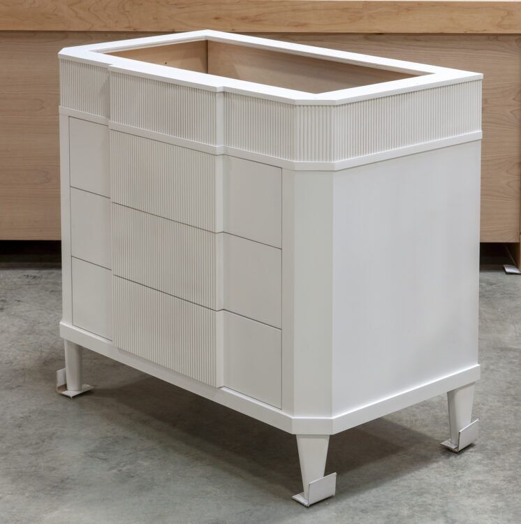 Reeded Vanity with Pipe Chase Drawers - Crown Point Cabinetry