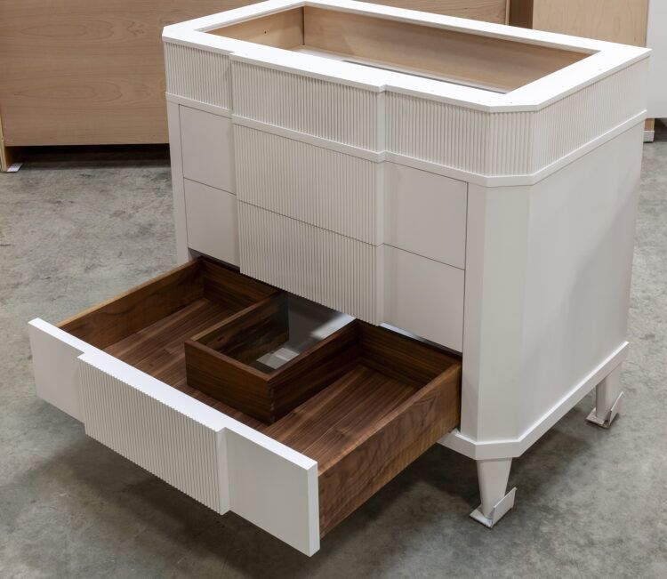 Reeded Vanity with Pipe Chase Drawers - Crown Point Cabinetry