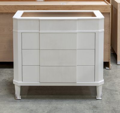 Reeded Vanity with Pipe Chase Drawers - Crown Point Cabinetry